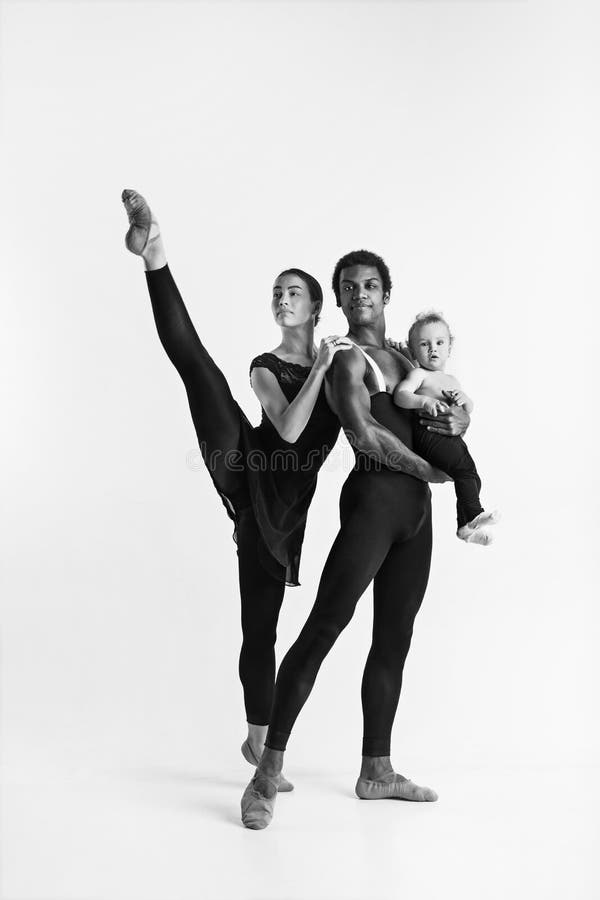 A Happy Family of Ballet Dancers on White Studio Background Stock Photo ...