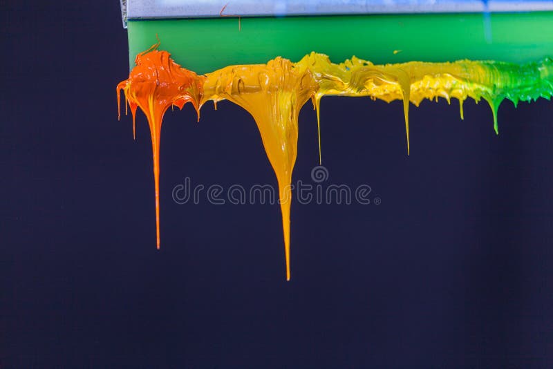 Colors Dripping from the Rubber Print Handle Stock Photo - Image of ...