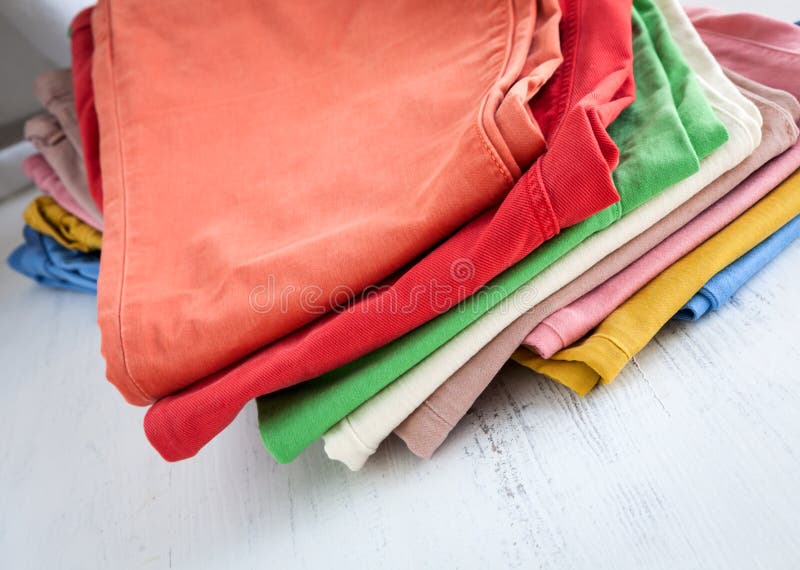 Colors Pants on Wooden Table Stock Photo - Image of broken, clothing ...