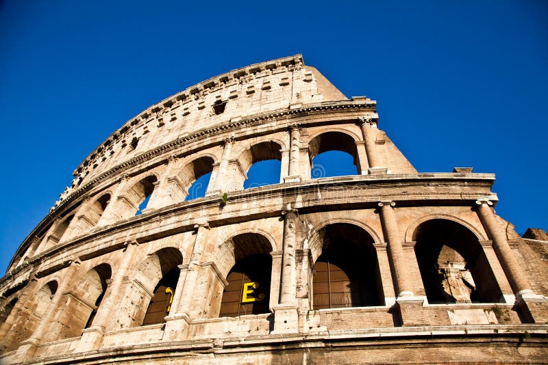 Colosseum with blue sky stock photo. Image of italy, architecture ...