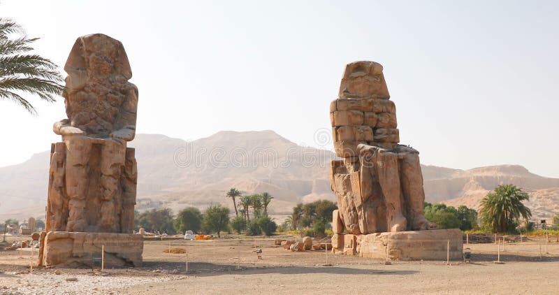 Colossi of Memnon Gigantic Statues in Luxor Egypt - Tilt View 4k Stock ...