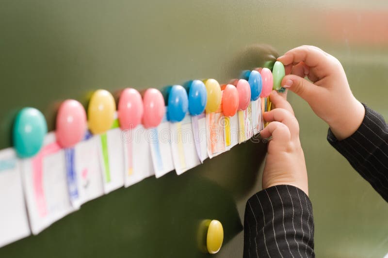 Colour decorative magnets. stock image. Image of hand - 7414555