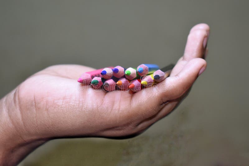 Colour pencil on hand stock photo. Image of petal, colour - 194400480