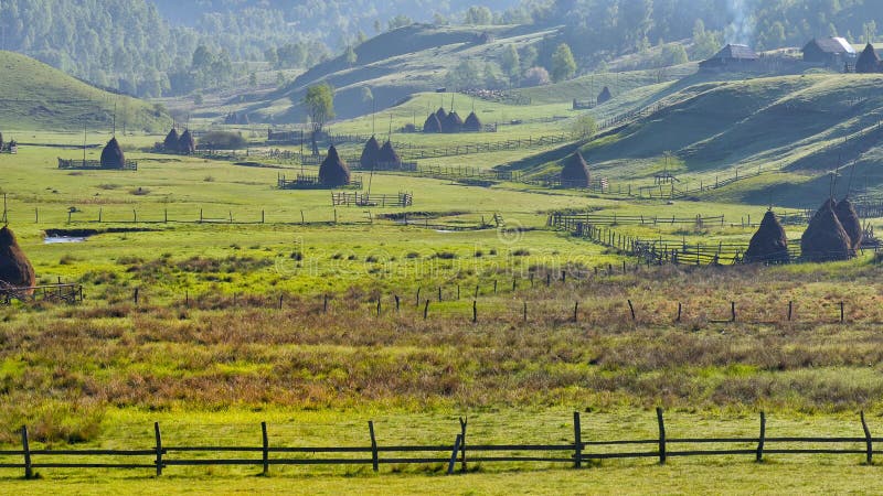 Colour Picture of Haystacks on a Hill in a Village . Stock Image ...