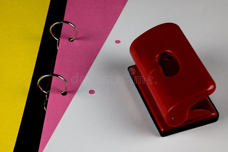 Coloured Card with Hole Punch and White Paper Sheet in an Open Ring ...