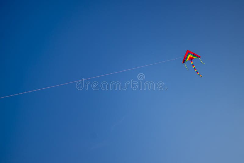 Colorful Kite on a Background of Blue Sky. Space for Text Stock Image ...