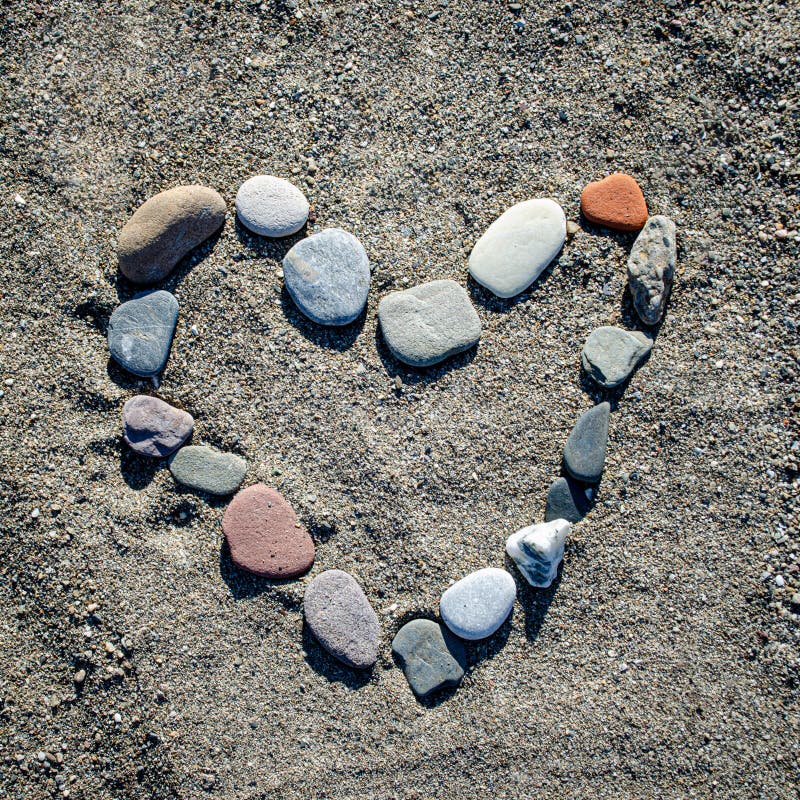 Coloured Pebble Stones Assembled in the Form of Heart on the Beach ...