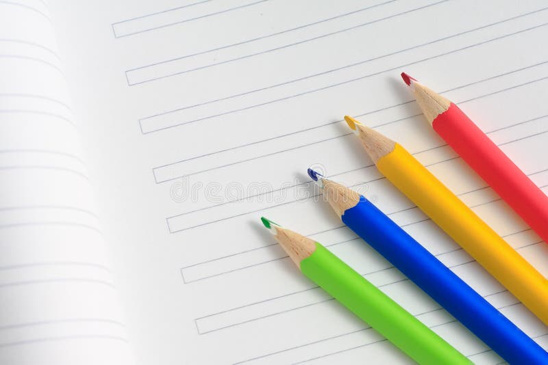 Coloured pencils stock photo. Image of notebook, crayon - 11750212