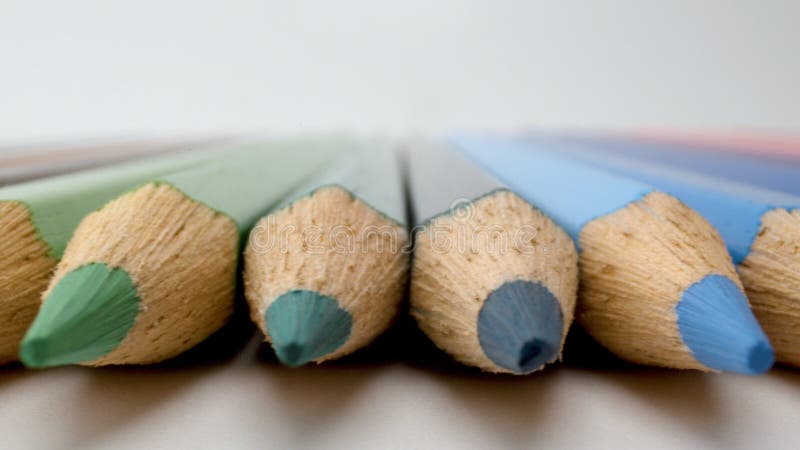 Coloured pencils in a row stock image. Image of shades - 204936101