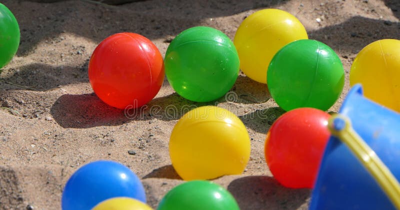 Colourful Balls Buckets and Spades in Childs Sand Pit Stock Photo ...