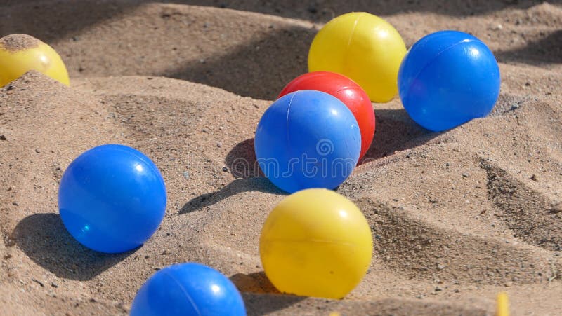 Colourful Balls Buckets and Spades in Childs Sand Pit Stock Image ...