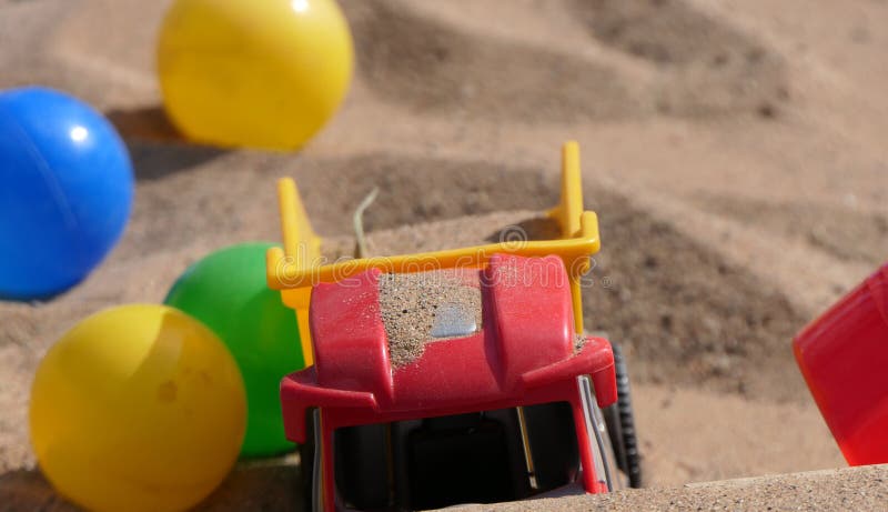 Colourful Balls Buckets and Spades in Childs Sand Pit Stock Photo ...