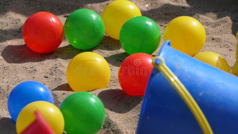 Colourful Balls Buckets and Spades in Childs Sand Pit Stock Photo ...