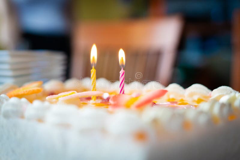 Colourful Birthday Cake Detail with Two Lit Candles Stock Photo - Image ...