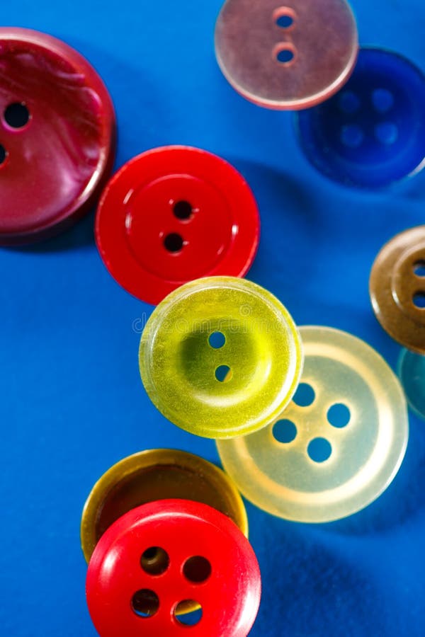 Colourful Buttons on Blue Background Stock Photo - Image of plastic ...