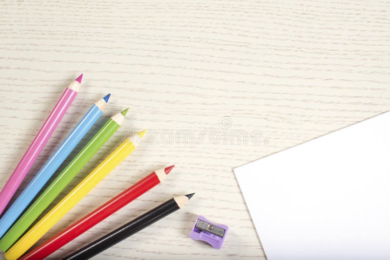 Crayons and Paper on White Plank Stock Image - Image of education ...