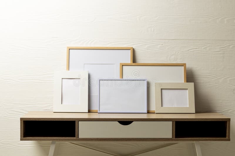 Colourful Empty Frames with Copy Space on Table Against White Wall ...