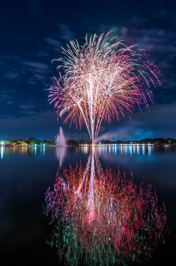 Colourful Fireworks with a Reflection on the Water for Celebration ...