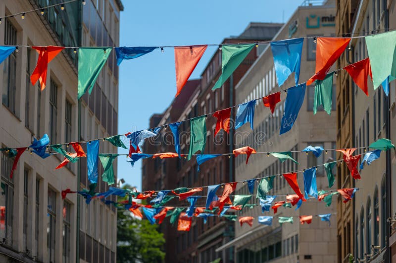 Colourful Flags Above a Shopping Street in Summer.. Stock Image - Image ...