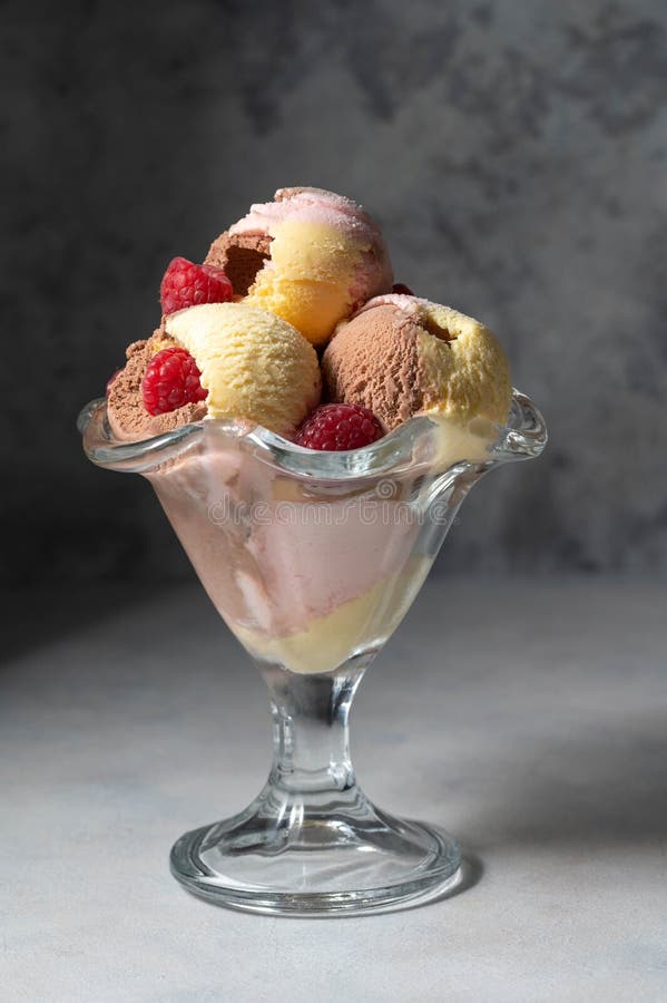 Colourful Ice Cream Scoops in Glass Cup, with Fresh Raspberries. Grey ...