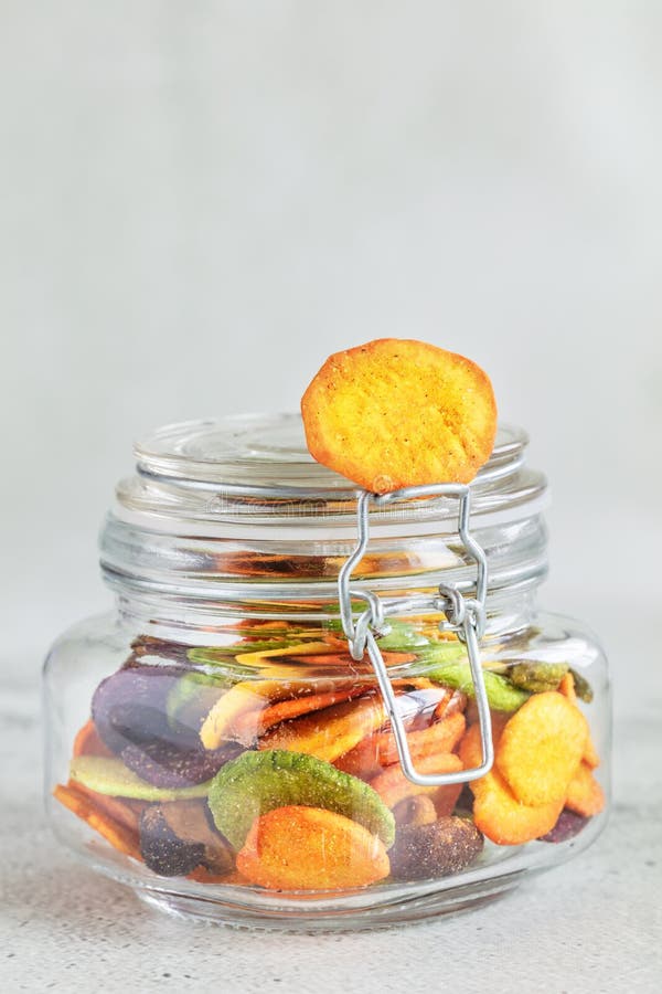 Colourful Mix Vegetable Chips in Glass Jar, Vertical Composition Stock ...