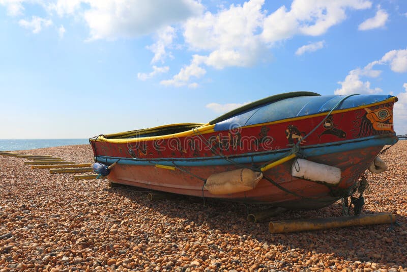 Old Colorful Painted Boat On A Beach Stock Photo - Image of danger ...