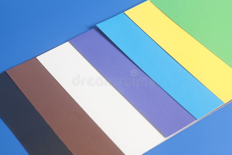 Colourful Paper Sheets on Blue Stock Image - Image of diversity ...