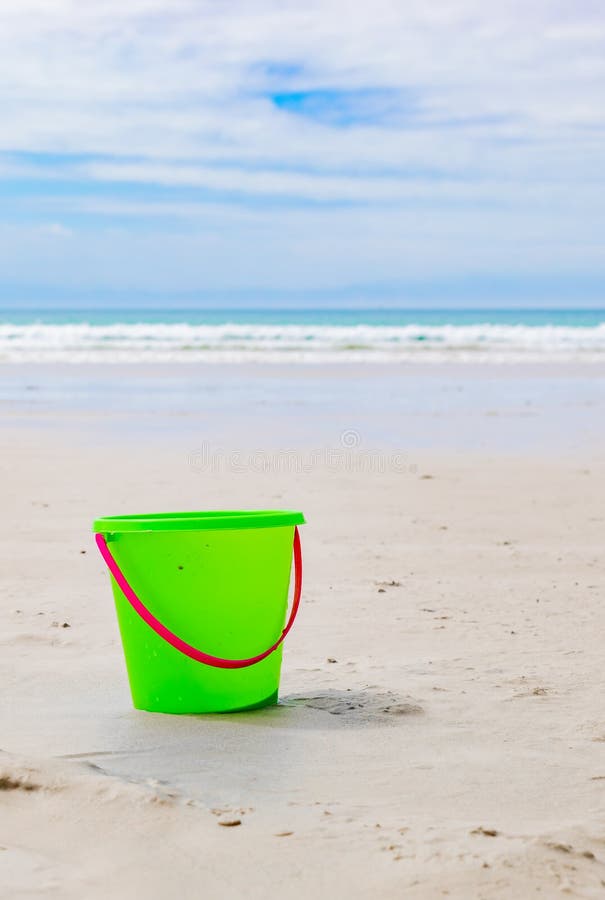 Plastic Kids Bucket for Making Sandcastles on a Sandy Beach Stock Photo ...