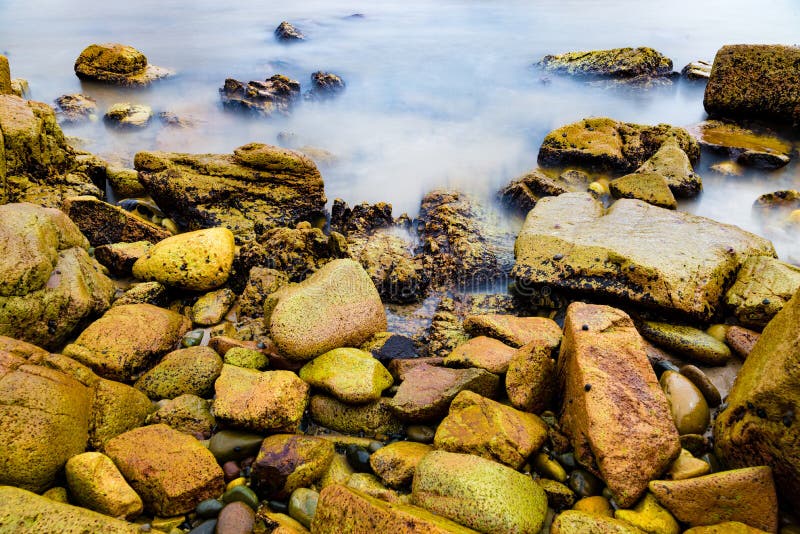 Colourful rocks and water stock photo. Image of head - 94444260