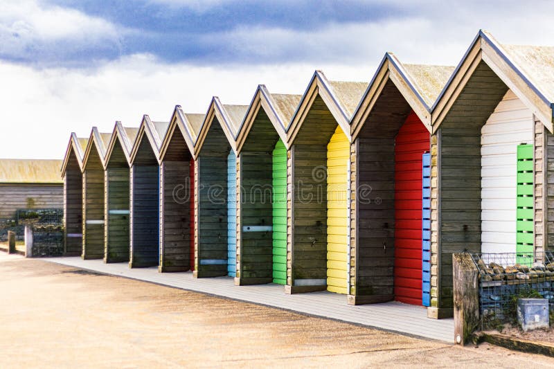 Colourful Row of Beach Huts Stock Photo - Image of beach, promenade ...