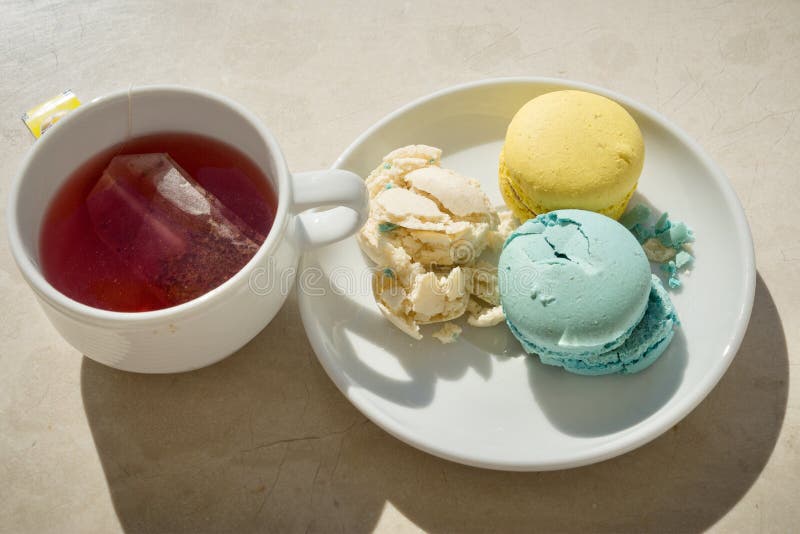 Three Parisian-style Macarons and Cup with Cardamon Tea Stock Image ...