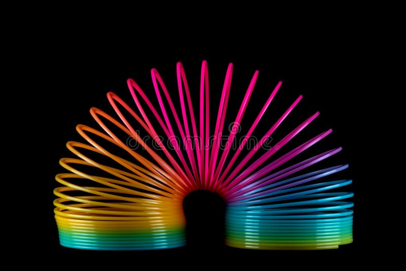 Colourful Slinky Spring Toy on a Black Background Editorial Stock Image ...