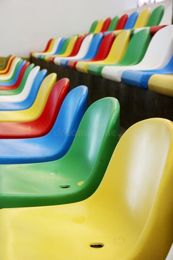 Colourful stadium seats stock photo. Image of watching - 79379044