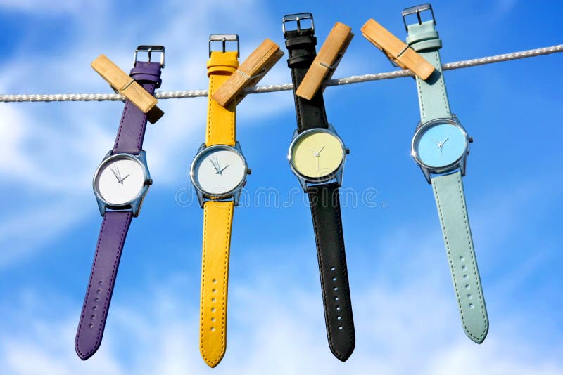 Colourful Watches on Blue Sky Background Stock Photo - Image of ...