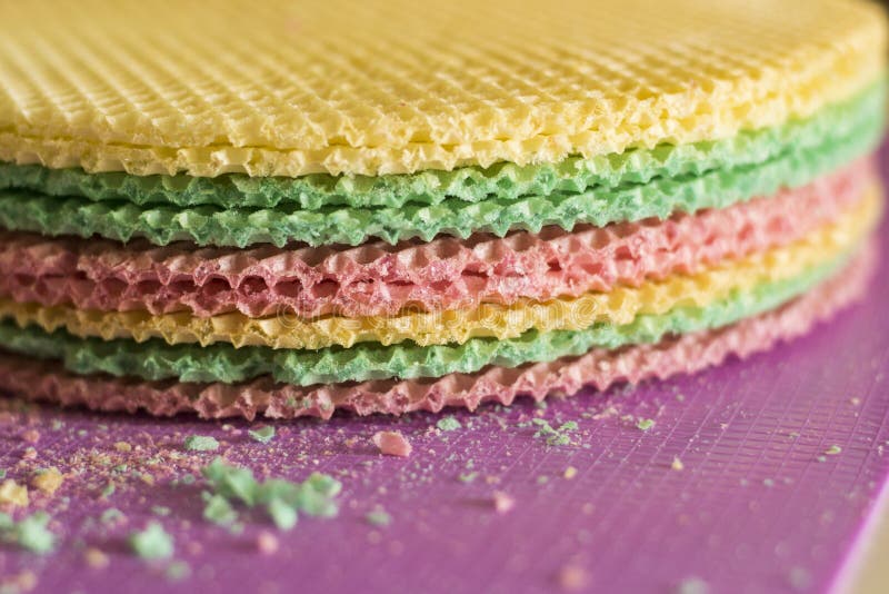 Colourfull Waffles on Purple Desk. Textured Abstract Background. Close ...