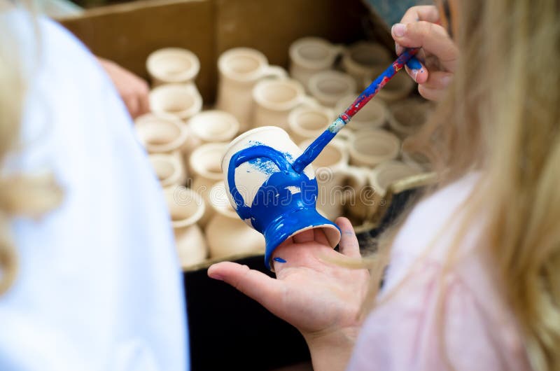 Colouring a pottery craft stock photo. Image of pottery - 86260816