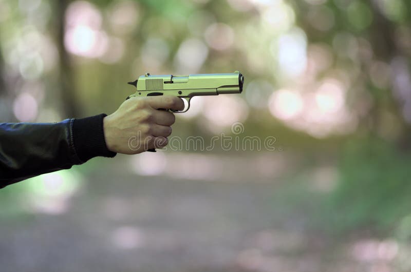 Colt weapon in the hand stock image. Image of handgun - 128047383