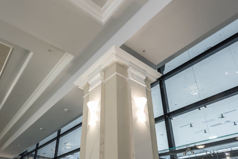 Column in Interior with Suspended and Grid Ceiling with Halogen Spots ...