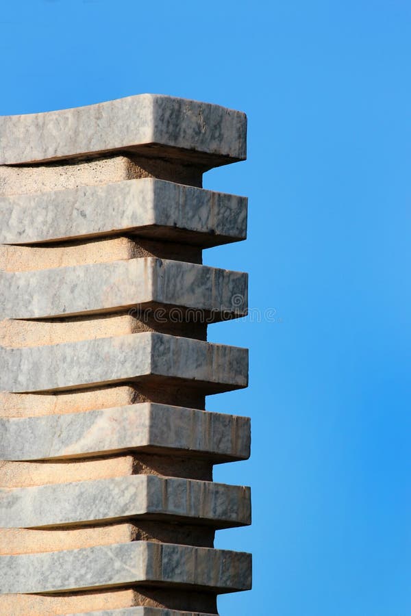 Column or Stack of Stone Blocks Against Blue Sky Stock Image - Image of ...