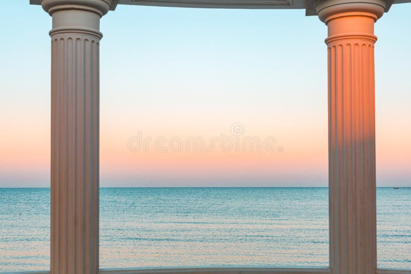 Columns Against the Dawn Sea and Sky Stock Image - Image of sculpture ...