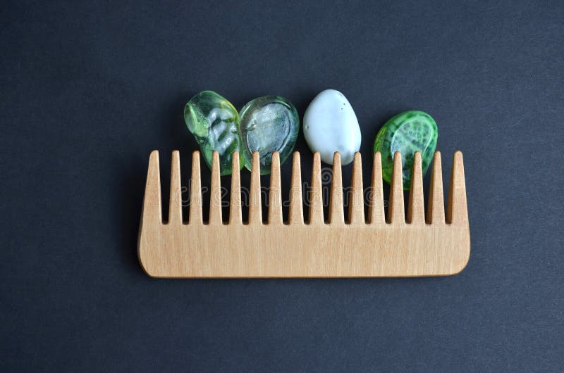 Comb Decorative Stones on a Black Background. Stock Image - Image of ...