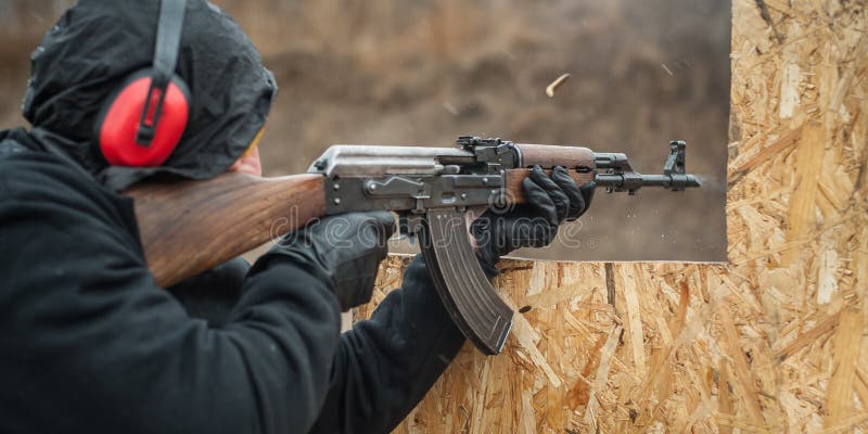 Combat Riffle Machine Gun Shooting from Behind Cover or Barricade Stock ...