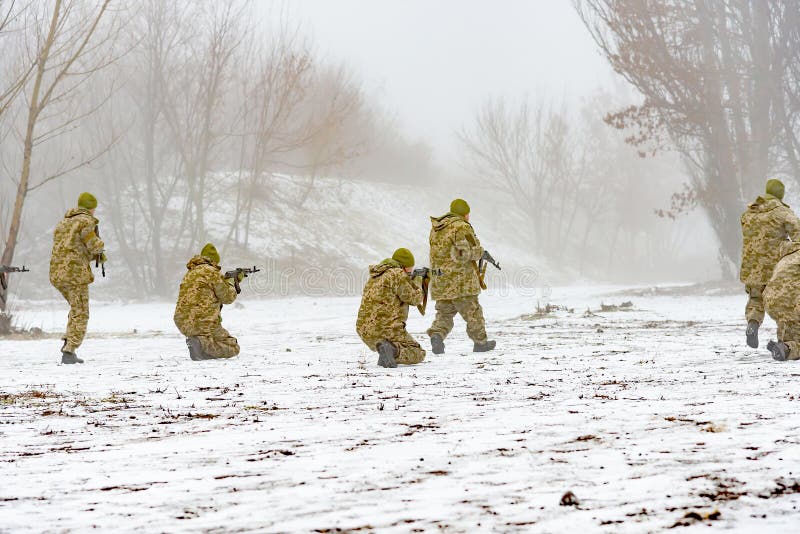 A Combat Squad in Camouflage with a Weapon Goes on the Offensive in ...