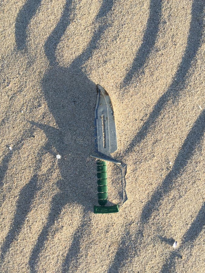 Knife in sand stock image. Image of curly, sand, swirl - 99464659