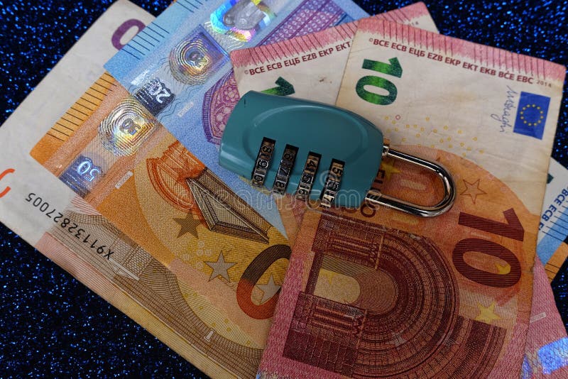 Combination Lock on Paper Currency Stock Photo - Image of currency ...