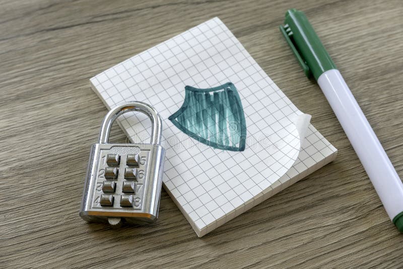 Combination Lock, Shield Drawing, and Green Pen on Graph Paper Notebook ...
