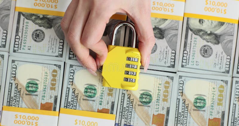 Combination Lock on a Stack of 100 Dollar Bills Stock Footage - Video ...