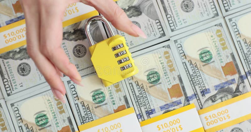 Combination Lock on a Stack of 100 Dollar Bills Stock Video - Video of ...