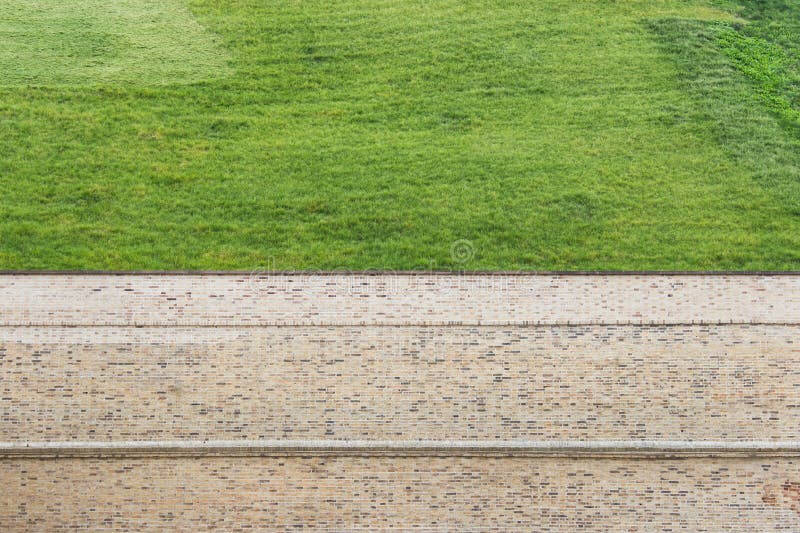 Combination of Two Textures - Trimmed Grass and Brown Brick Wall Stock ...
