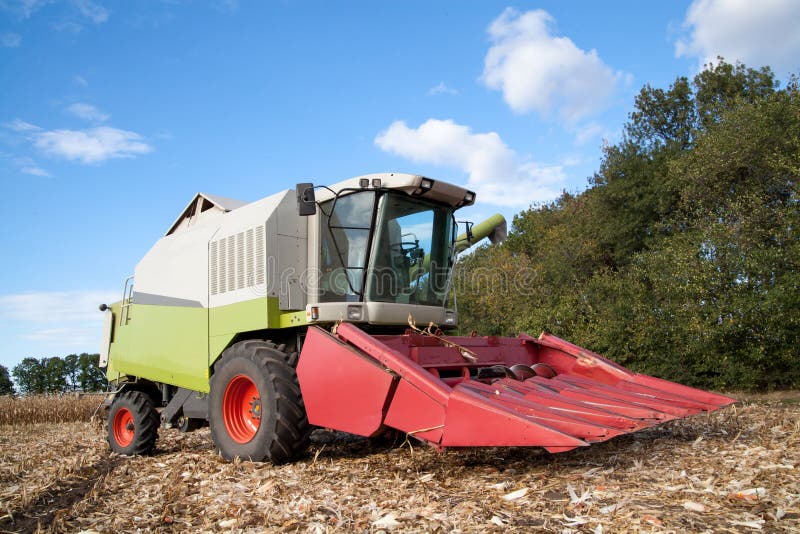 Combine on a field stock image. Image of cutting, corn - 37741481